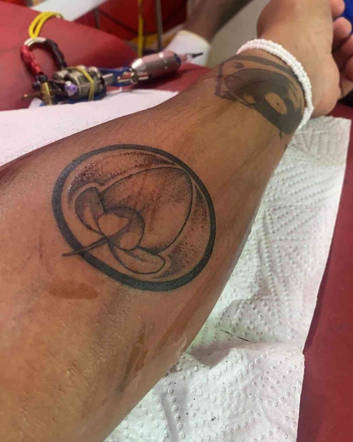 Josiah De Disciple Tattoos FL Studio Logo On His Arm - ZAtunes